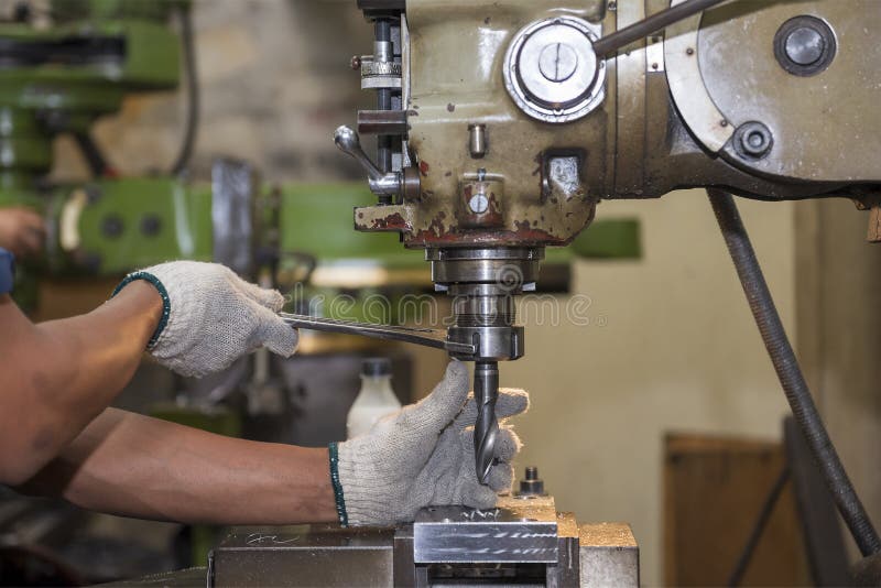 The Machine Operator Change the Cutting Tool with NC Milling Machine ...