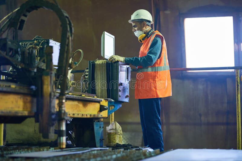 Machine Operator Concentrated on Work Stock Photo - Image of equipment ...