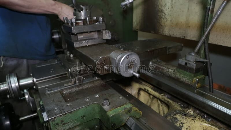 Machine Operator Operates on Old Lathe Machine. Turning Lathe in Action ...