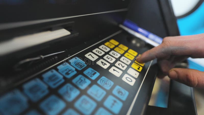 The Machine Operator Presses the Buttons of the CNC Machine. Injection ...