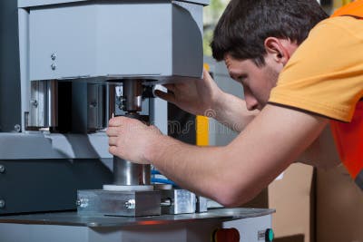 Machine operator at work stock image. Image of manufacturing - 41548721