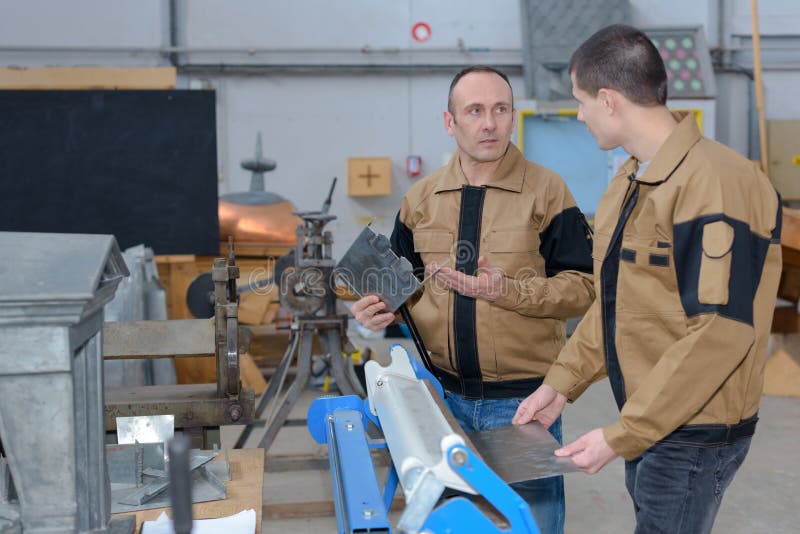 Machine Operators Having Conversation Stock Image - Image of business ...