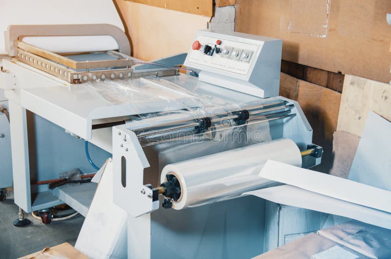 Machine for Packing Products with Plastic Wrap Stock Image - Image of ...
