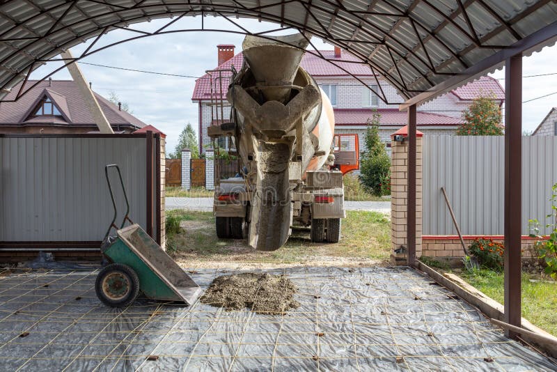 The Machine is Pouring Concrete Mix at a Construction Site. Stock Image ...