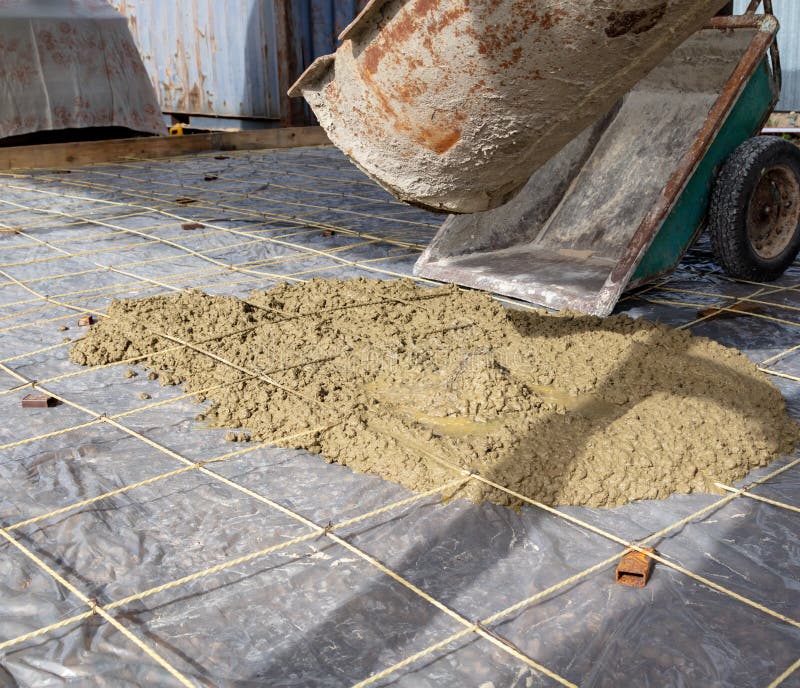 The Machine is Pouring Concrete Mix at a Construction Site. Stock Image ...