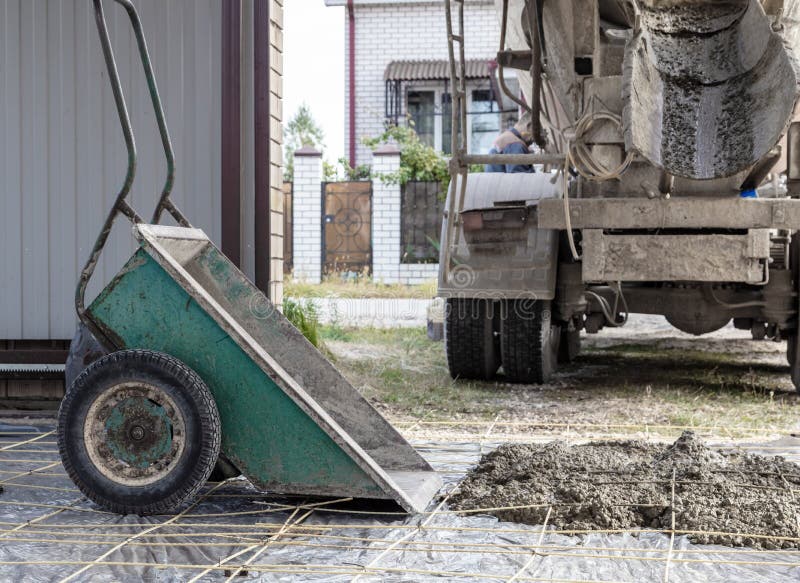 The Machine is Pouring Concrete Mix at a Construction Site. Stock Image ...