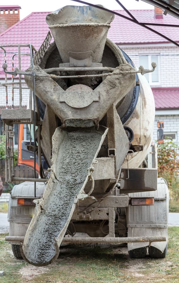 The Machine is Pouring Concrete Mix at a Construction Site. Stock Photo ...