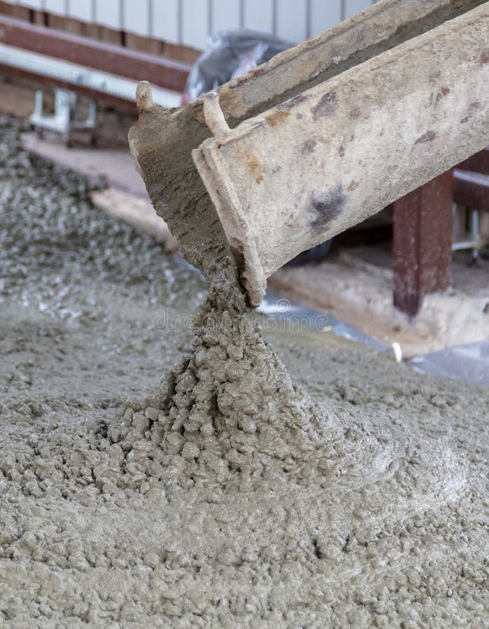 The Machine is Pouring Concrete Mix at a Construction Site. Stock Image ...