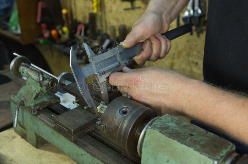 Working on a Lathe. the Machine is Ready for Work. the Wizard Checks ...