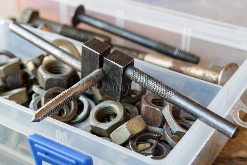 Machine Tap with the Old Bolts and Nuts in a Storage Box Stock Photo ...