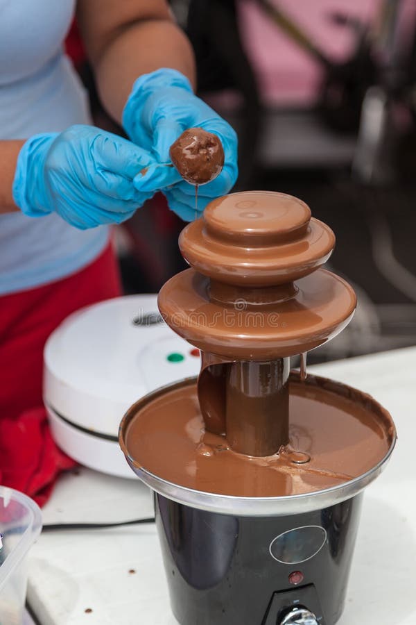 Machine to melt chocolate stock photo. Image of sweet - 128026782