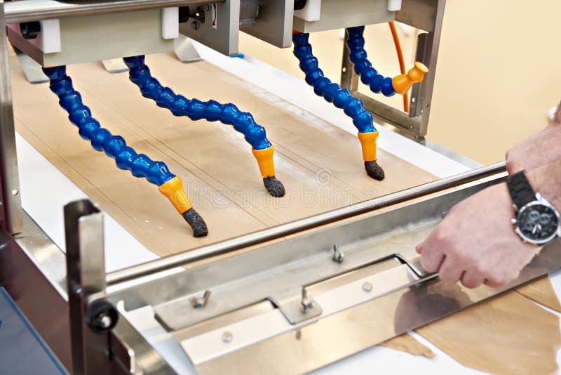 Machine with Tubes for Dough Filling and Baker Stock Image - Image of ...