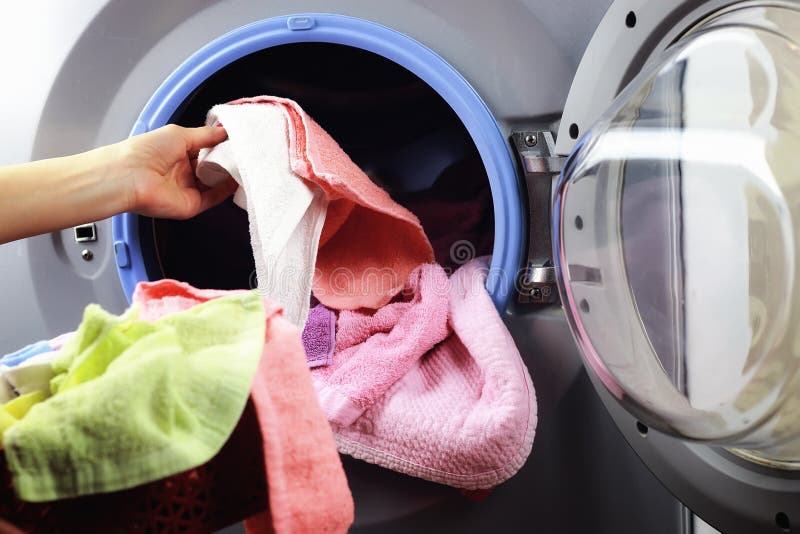 Machine Washer hand put stock photo. Image of adult, domestic - 80349112
