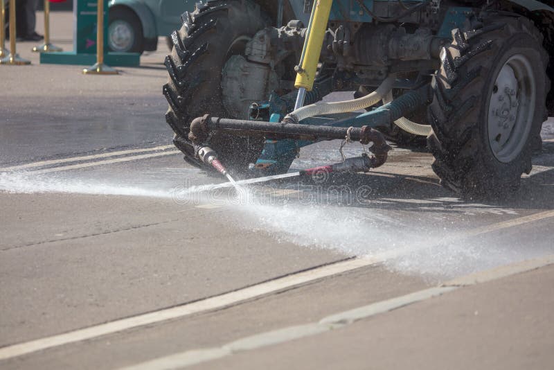 The Machine Washes the Road with Water Stock Photo - Image of ...