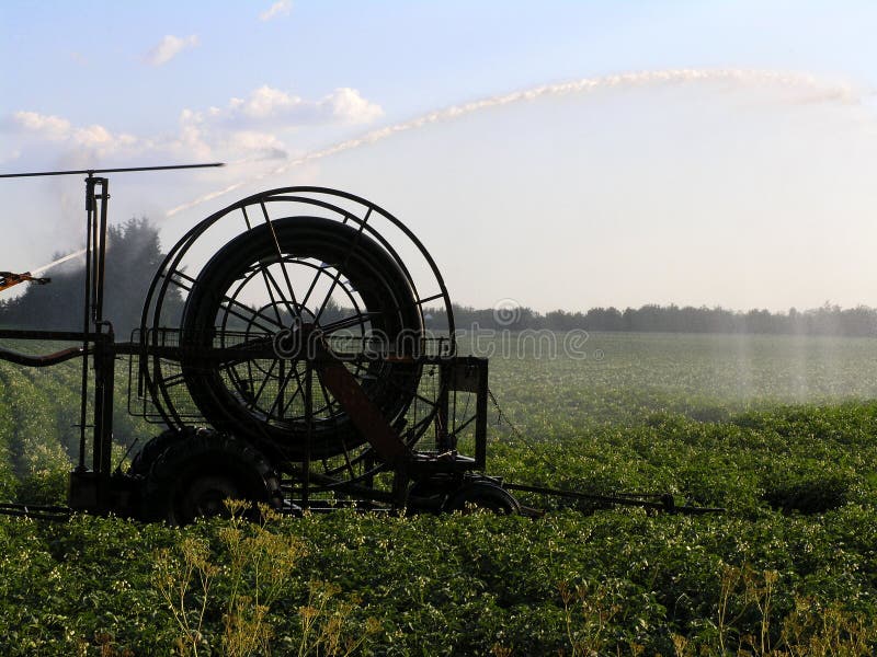 Machine watering field stock photo. Image of appliance - 647140