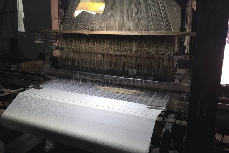 A Machine is Weaving Silk Thread Onto a Piece of Silk Fabric in Hanoi ...