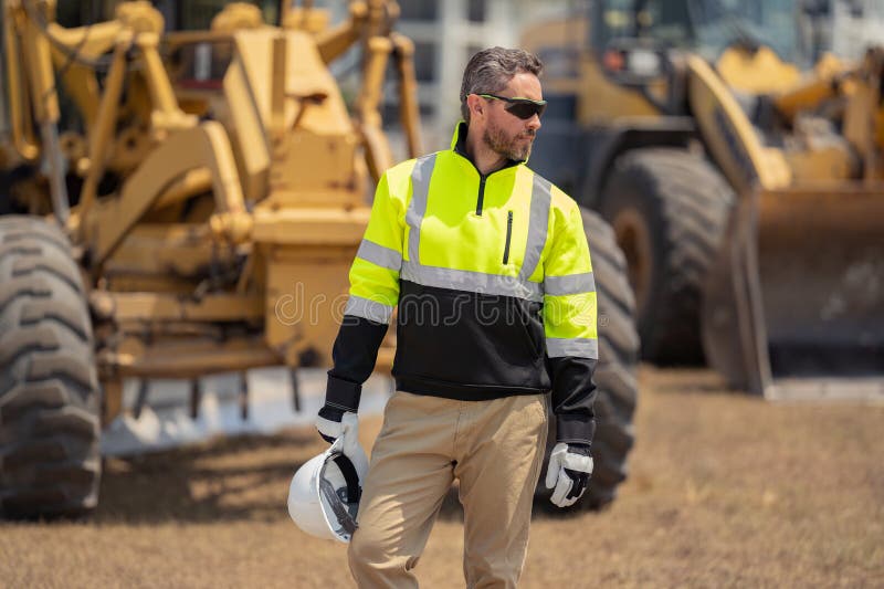 Machinery Builder at Buildings Background. Excavator Loader Tractor and ...