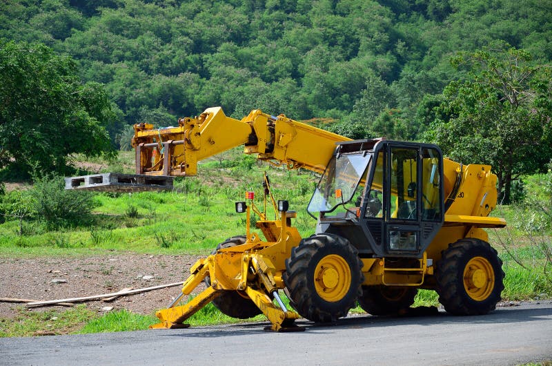 Machinery at Construction Site Stock Photo - Image of tree, parking ...