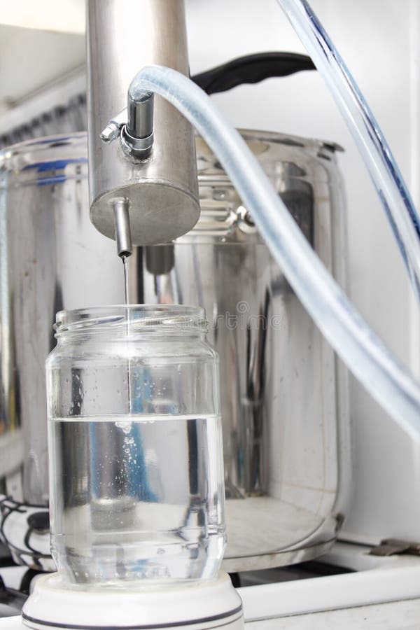 Home Alcohol Product. Cooking Moonshine in the Kitchen. Silver ...