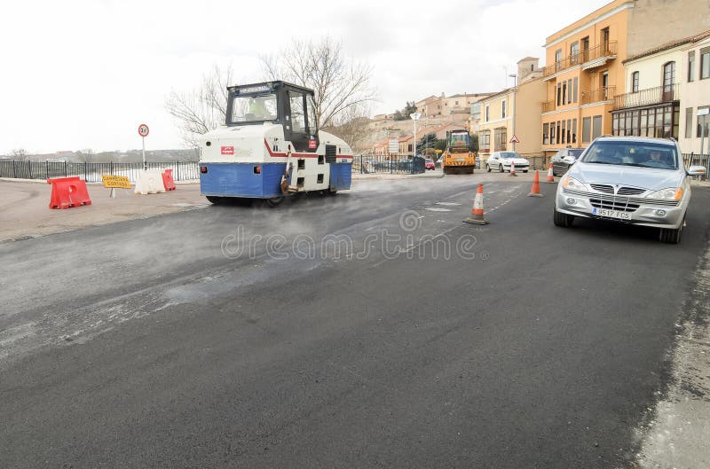 Machines Performing Asphalting and Paving Work on a City Road ...