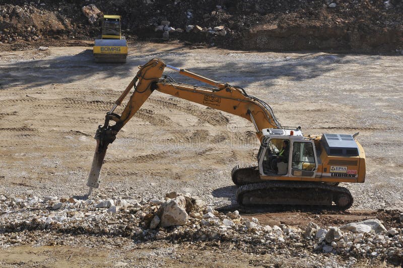 Front Loader Dumping Debris on Construction Site Stock Image - Image of ...