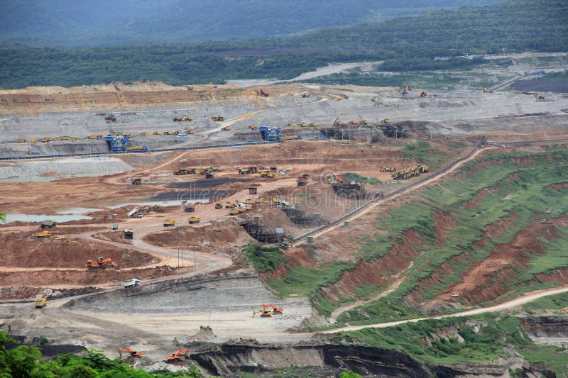 Machines are Working in Large Mines with Mountains As Background Stock ...
