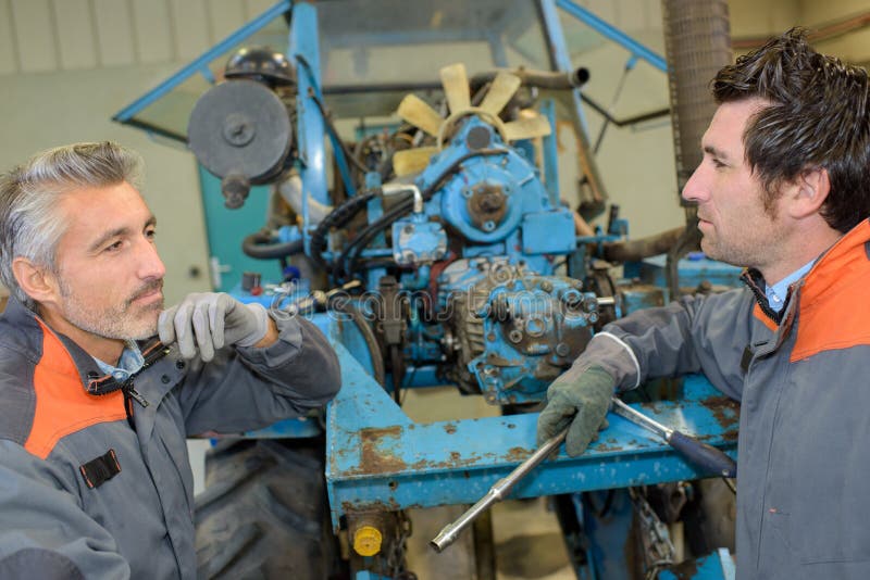 Machinist fixing a machine stock image. Image of topic - 133527897