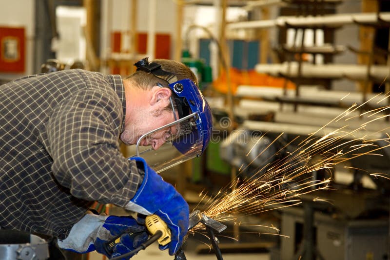 Machinist Grinding Metal stock photo. Image of construction - 6189318