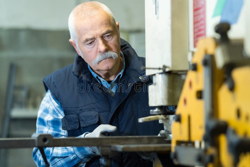 Machinist Operating a Machine Stock Image - Image of solid, operating ...