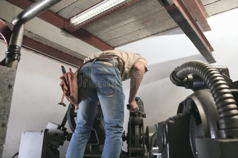 Machinist Worker Technicians at Work Adjusting Stock Photo - Image of ...