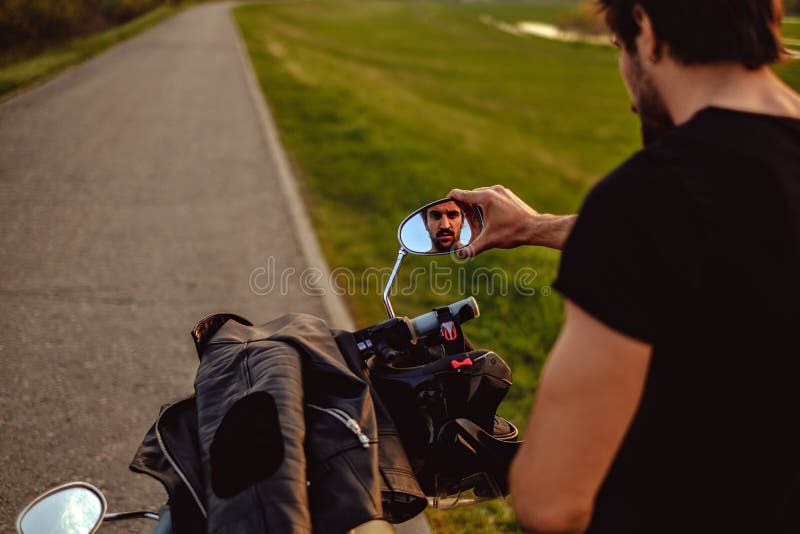 Man Looking at the Mirror on His Motorcycle Stock Photo - Image of ...