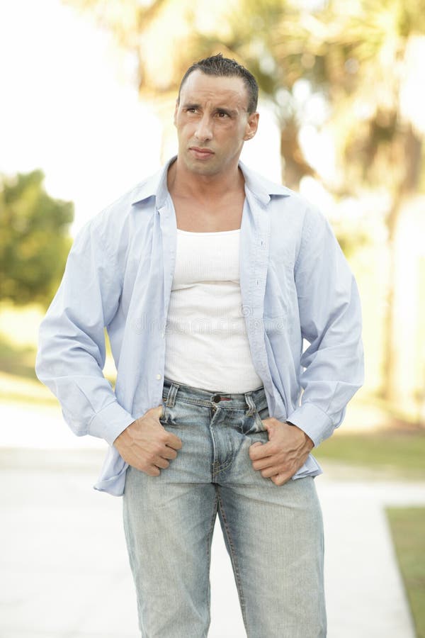 Macho man in the park stock image. Image of forties, strong - 17832979