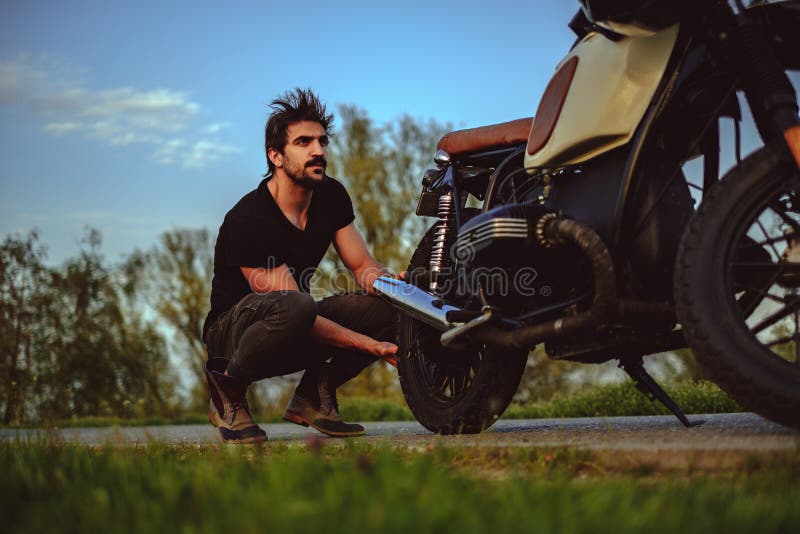 Macho Man Checking Tire on His Motorcycle Stock Photo - Image of beard ...