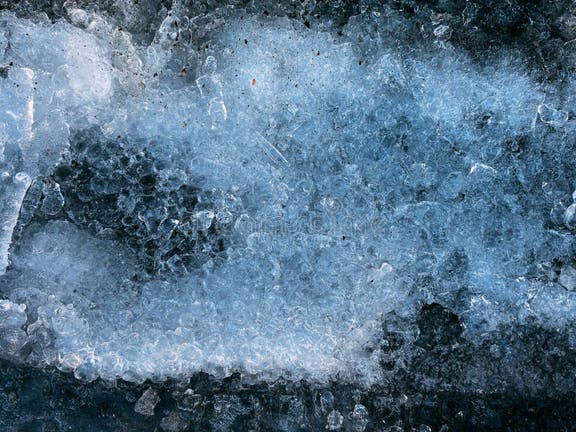 Macro Background of Blue-Tinged Chunky Ice on a Dark Surface Stock ...