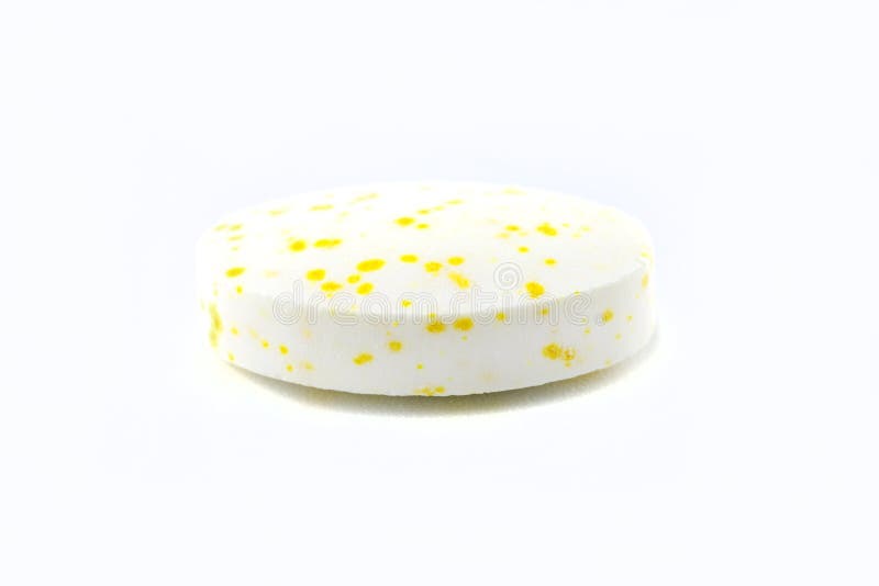 A Macro Background Made of a Single White Candy with Yellow Spots ...