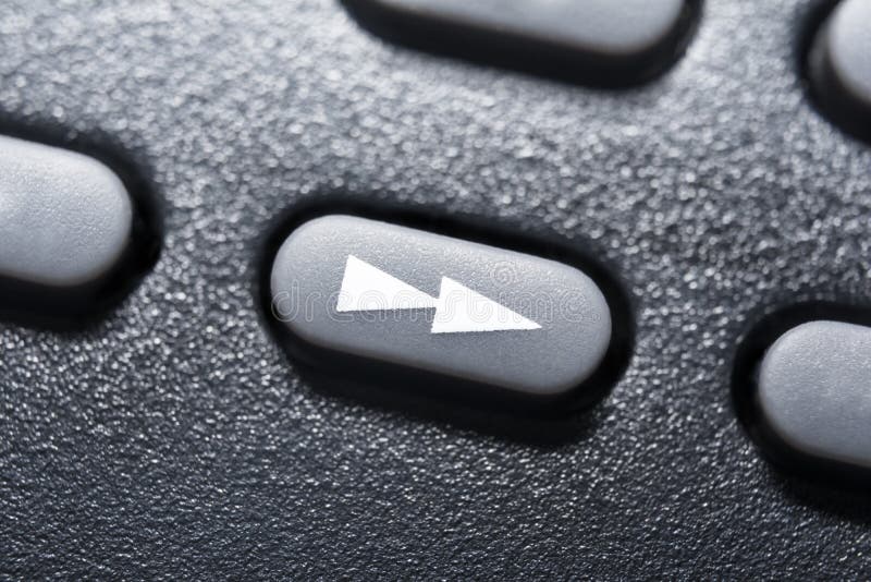 Macro of a Black Fast Forward Button on Black Remote Control for a Hifi ... Macro of a Black Fast Forward Button on Black Remote Control for a Hifi ...