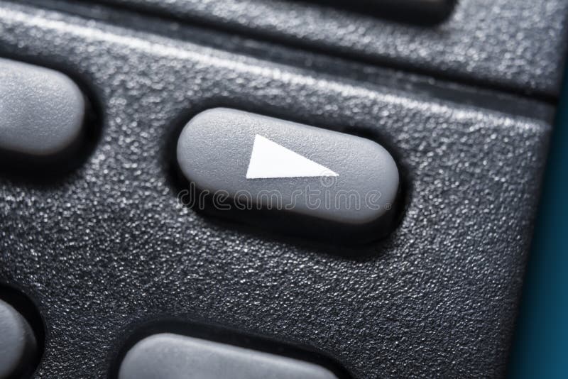 Macro of a Black Play Button on Black Remote Control for a Hifi Stereo ...