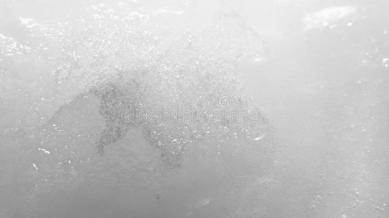 Macro Breaking Ice Texture with Splashing Water Surface, Ripples and ...