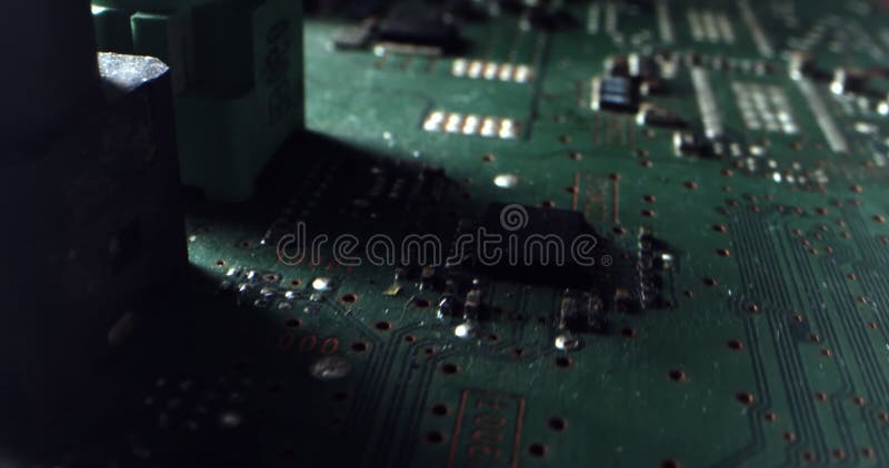 Macro Camera Moving Slowly Over Printed Circuit Board, Showing Computer Motherboard Components ...