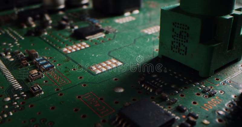 Macro Camera Moving Slowly Over Printed Circuit Board, Showing Computer Motherboard Components ...