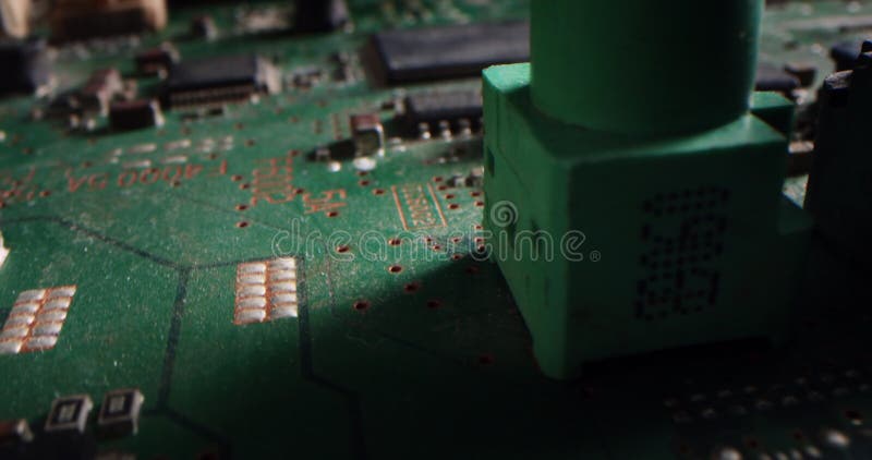 Macro Camera Moving Slowly Over Printed Circuit Board, Showing Computer Motherboard Components ...