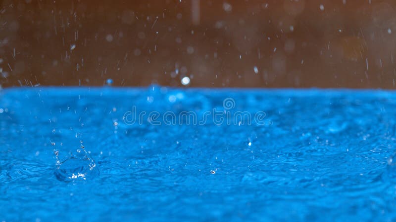 MACRO: Clear Raindrops Create a Ripple Effect on the Surface of an ...
