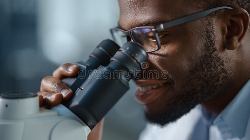 Macro Close Up Shot of a Handsome Black Male Scientist Wearing Glasses ... Macro Close Up Shot of a Handsome Black Male Scientist Wearing Glasses ...