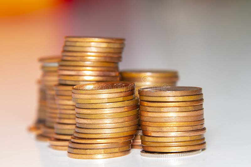 Stack of gold tinted coins stock photo. Image of gold - 189437538