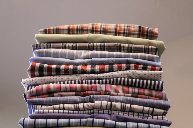 Close-up of a Tall Isolated Stack of Folded Colorful Mens Button Down ...