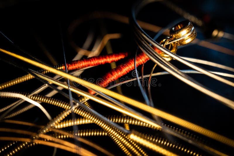 Closeup of Ball End on Guitar String Surrounded by Circle of Used Loose ...