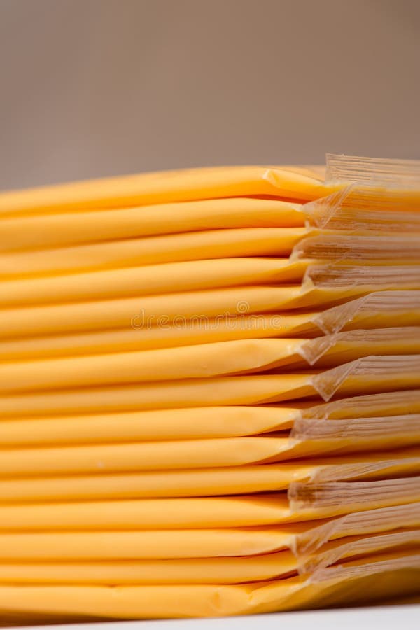 Macro Closeup Photo of Individually Packed Slices of Cheese Stock Photo ...