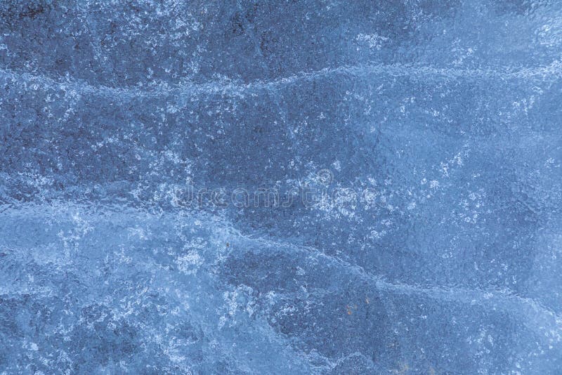 The Macro or Closeup Shot of Ice Texture or Background on the Puddle or ...
