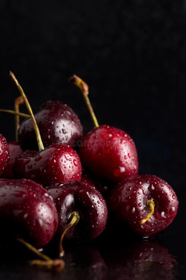 Macro of Delicious Fresh Red Wet Cherries with Black Background Stock ...