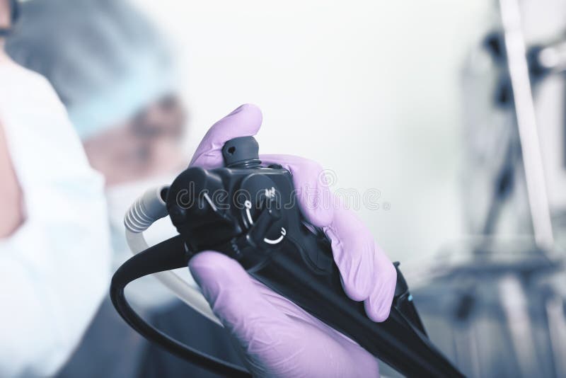 Endoscope in Doctor`s Hand during Medical Procedure. Stock Photo ...